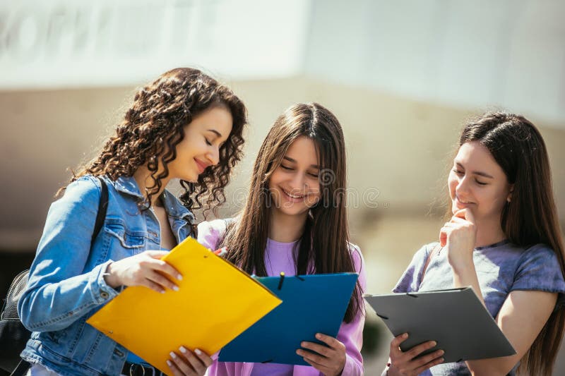 Students with Notebook Studying Together Outdoors Stock Photo - Image ...