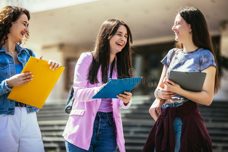 Students with Notebook Studying Together Outdoors Stock Photo - Image ...