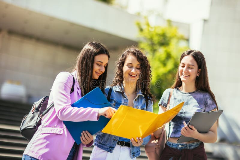 Students with Notebook Studying Together Outdoors Stock Photo - Image ...