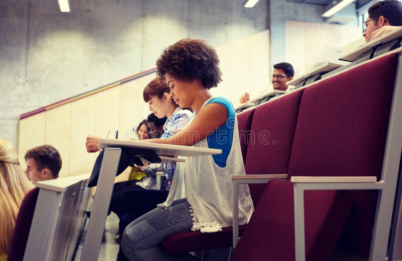 Group of Students with Notebooks at Lecture Hall Stock Image - Image of ...