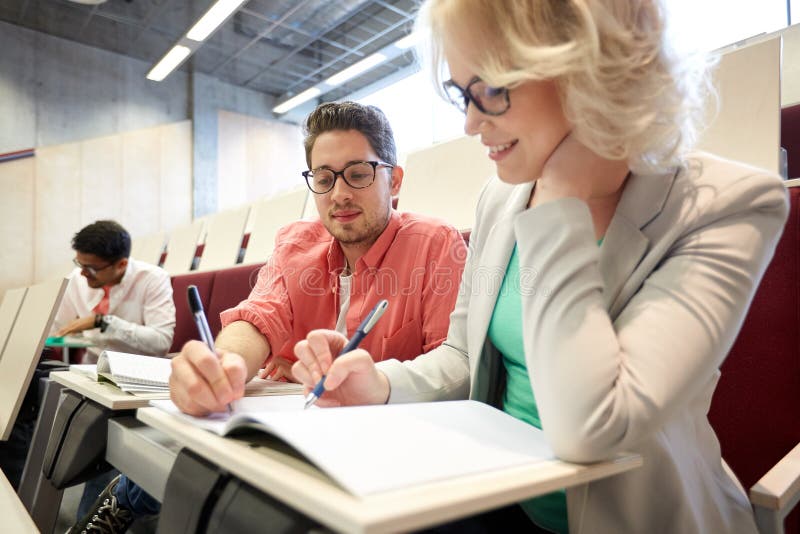 Group of Students with Notebooks at Lecture Hall Stock Photo - Image of ...