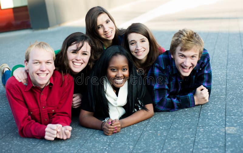 Group Of Four Happy Teenagers Outside Stock Image - Image of school ... Group Of Four Happy Teenagers Outside Stock Image - Image of school ...