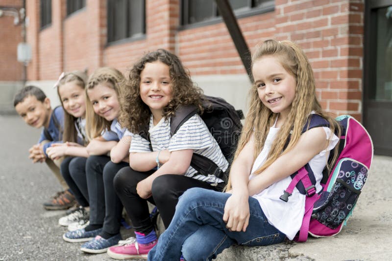 A Group of Students Outside at School Standing Together Stock Image ...