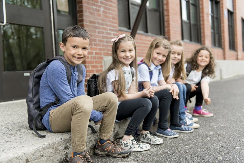 A Group of Students Outside at School Standing Together Stock Image ...