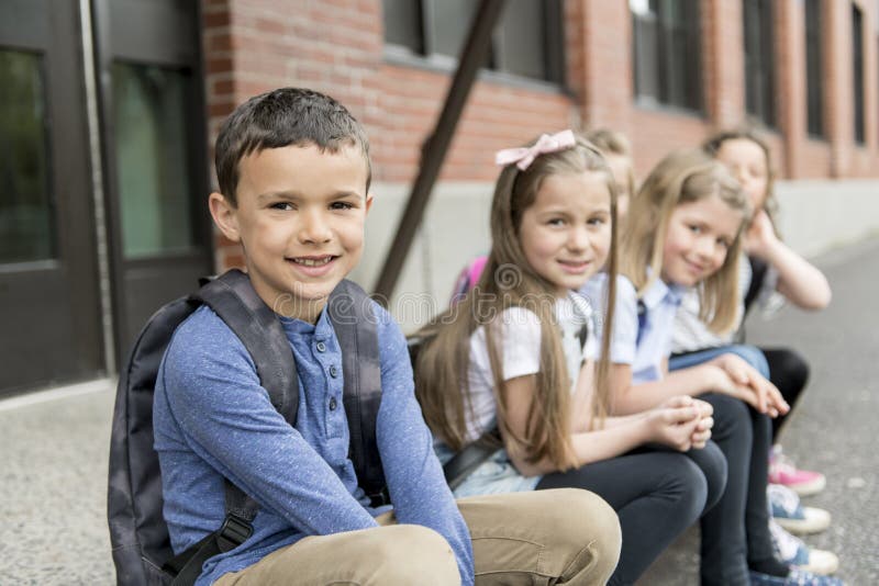 A Group of Students Outside at School Standing Together Stock Photo ...