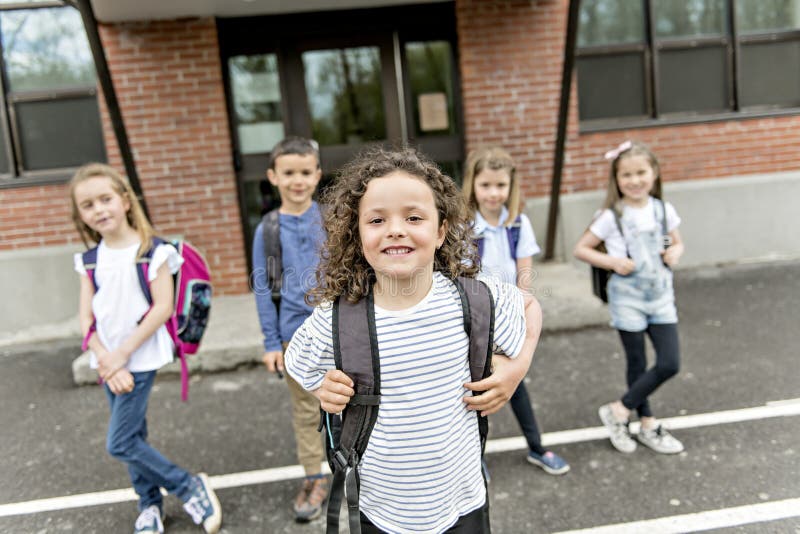 A Group of Students Outside at School Standing Together Stock Image ...