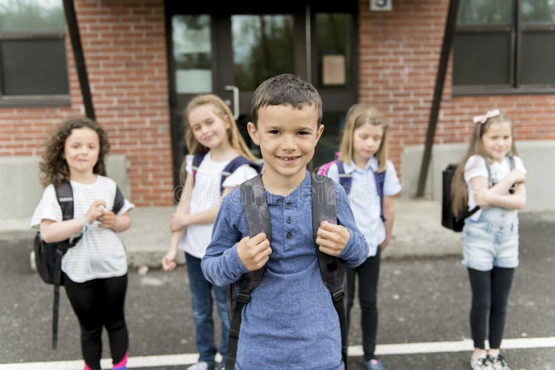 A Group of Students Outside at School Standing Together Stock Image ...