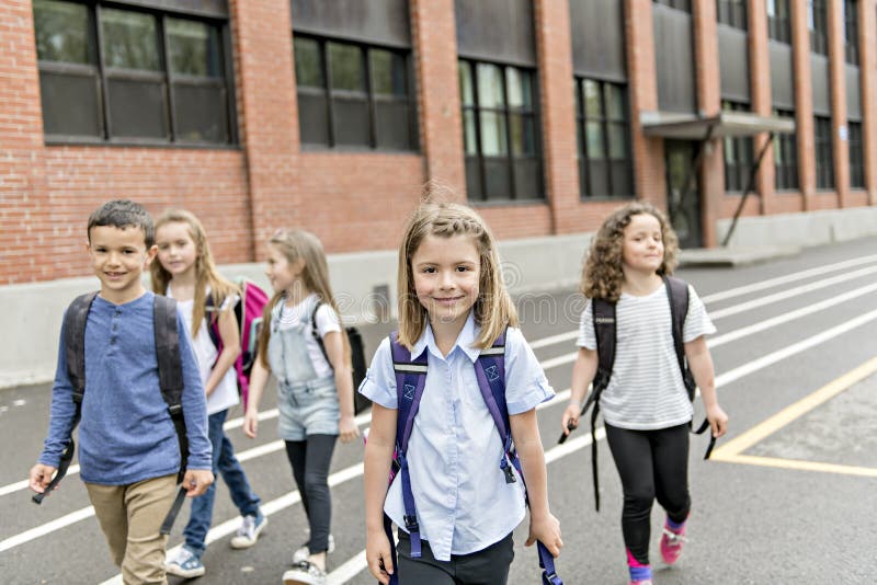 A Group of Students Outside at School Standing Together Stock Image ...