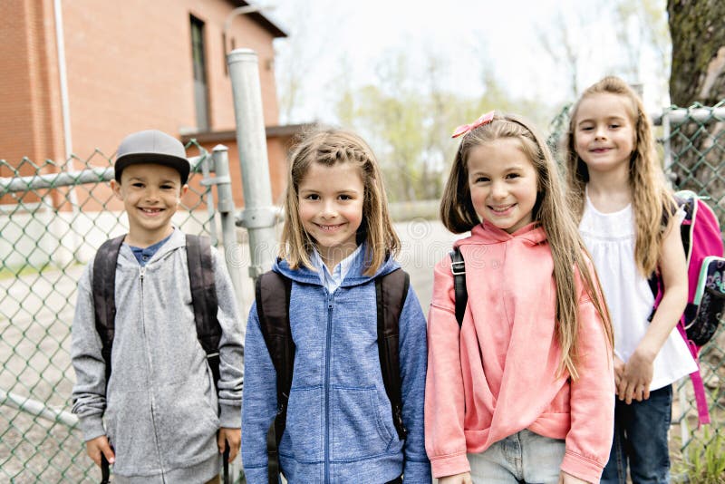A Group of Students Outside at School Standing Together Stock Photo ...