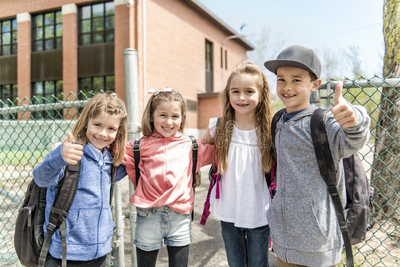 A Group of Students Outside at School Standing Together Stock Image ...