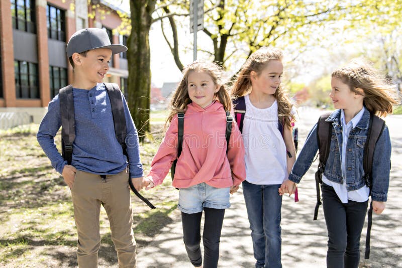 A Group of Students Outside at School Standing Together Stock Photo ...