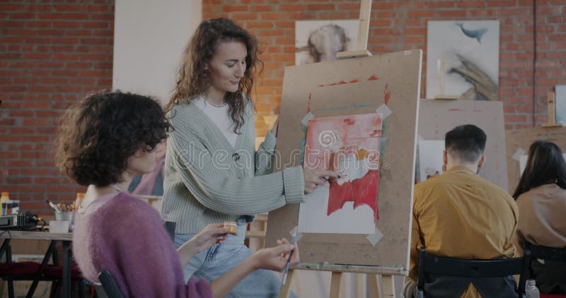 Group of Students Painting Enjoying Master Class while Professional ...