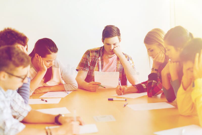 Group of Students with Papers Stock Image - Image of serious, solving ...