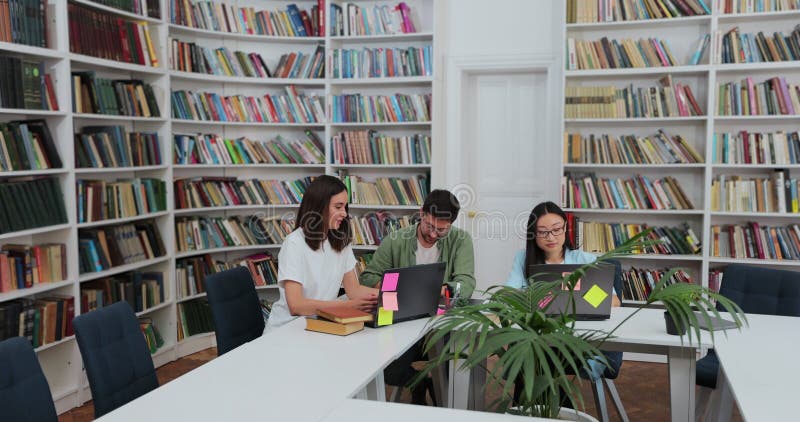 Group of Students Preparing for Exam in University Library. Happy ...