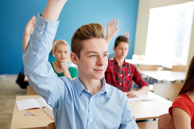 Group of Students Raising Hands at School Lesson Stock Image - Image of ...