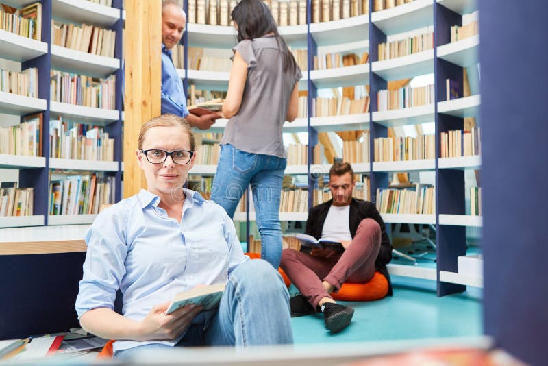 Group of Students Reading the Book in the Library Stock Photo - Image ...