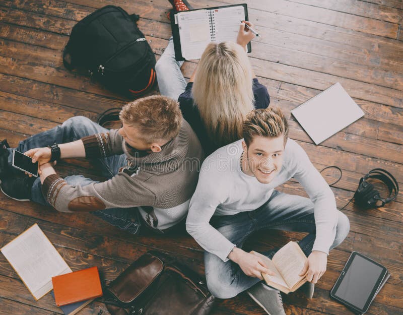 Group of Students Reading Books, Writing in Notebooks Stock Image ...