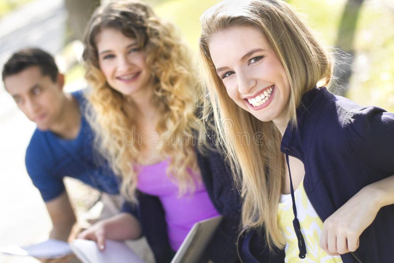Group of Students Sitting on a Bench Stock Photo - Image of young ...