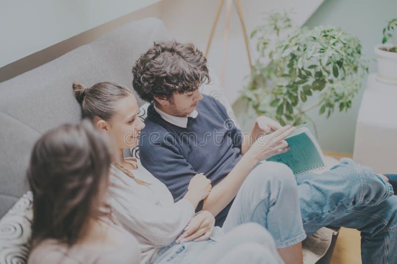 Group of Students Studying Together on a Cozy Couch Stock Photo - Image ...