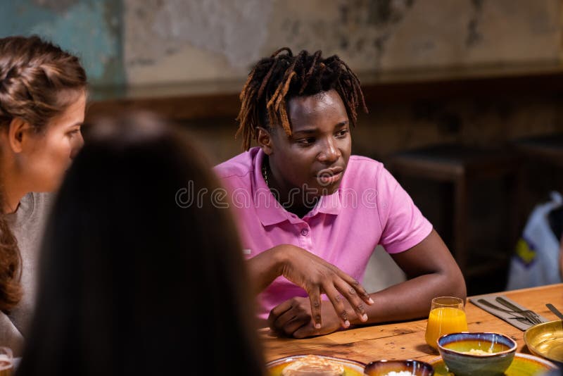 A Group of Students Sitting in the Hostel Common Area and Chatting ...