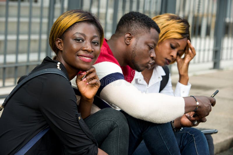 Group of Students Sitting Side by Side Stock Photo - Image of american ...