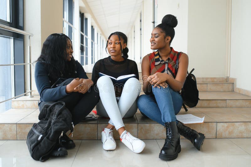 Group of Students Sitting on Steps Stock Image - Image of indoors ...