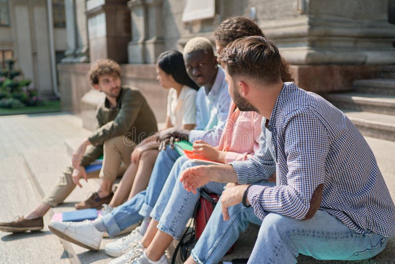 Group of Students Sitting on the Steps. Stock Image - Image of ...