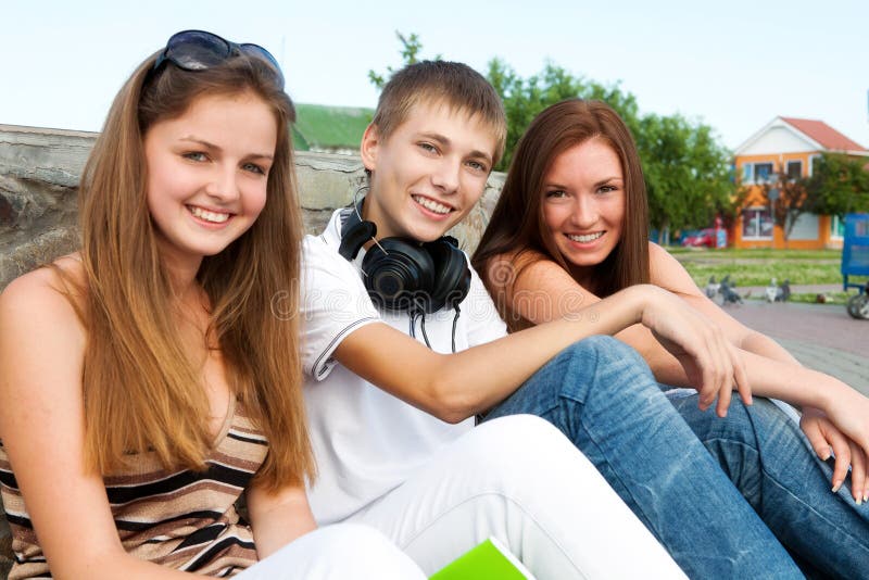 Group of Students Sitting on Street Stock Photo - Image of fashion ...