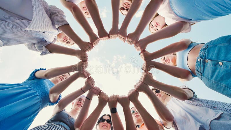 Group of Students is Standing in a Circle, Joining Their Fists Together ...