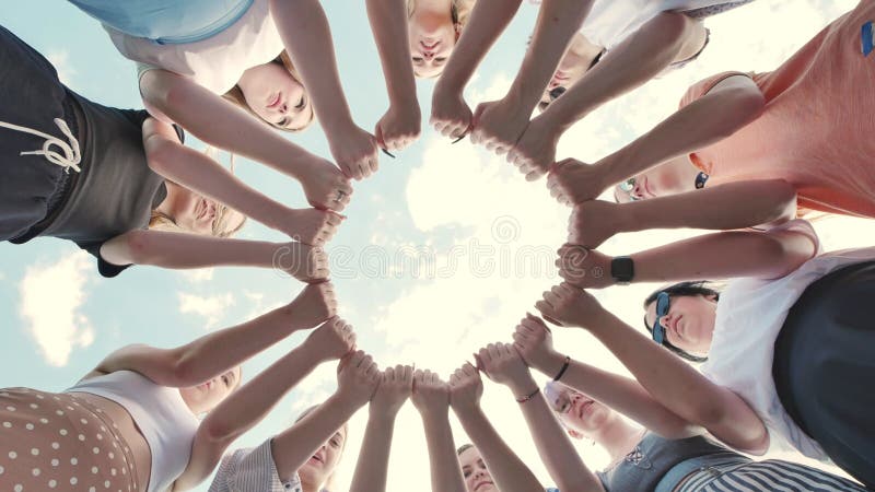 Group of Students is Standing in a Circle, Joining Their Fists Together ...