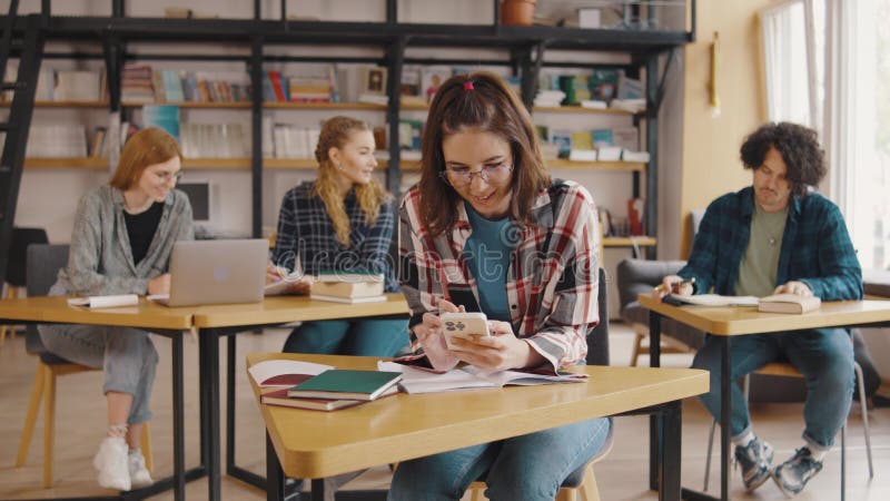 A Group of Students Study and Read Books, Write Information in ...