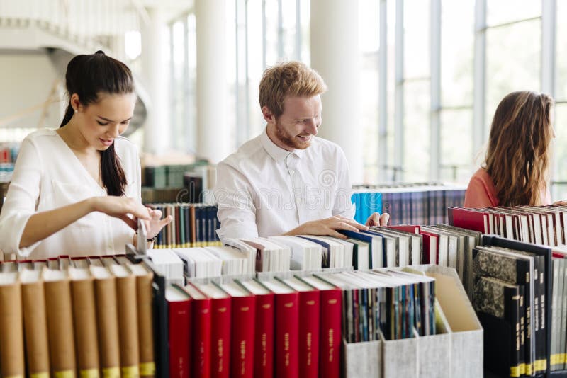 Group of Students Studying in Library Stock Photo - Image of reading ...