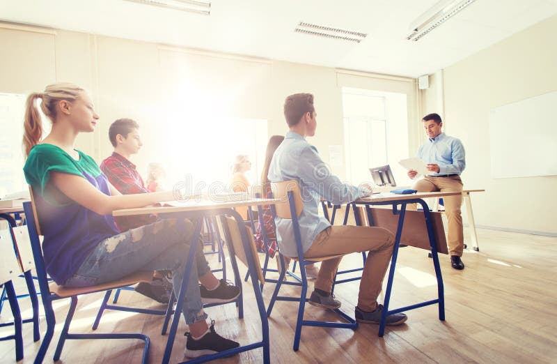 Group of Students and Teacher with Papers or Tests Stock Photo - Image ...