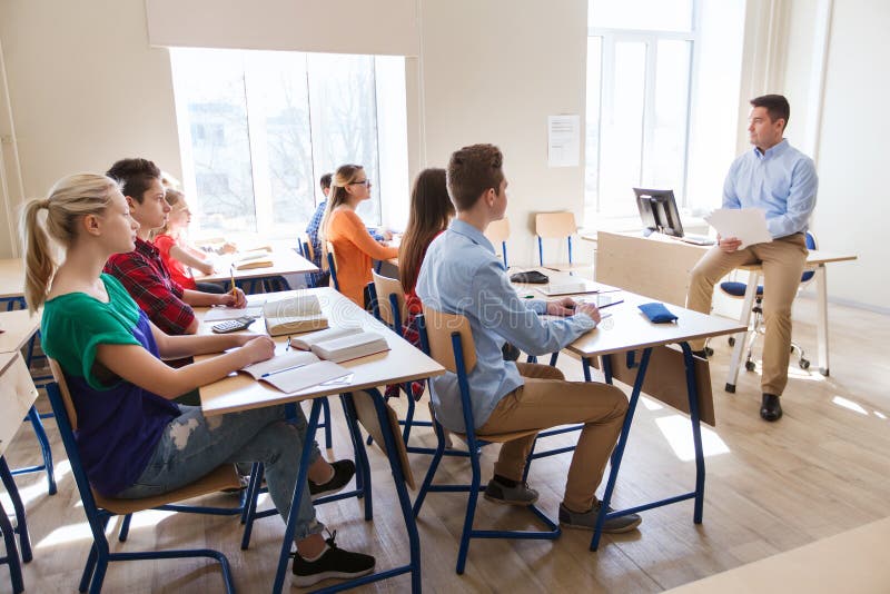 Group of Students and Teacher with Papers or Tests Stock Image - Image ...