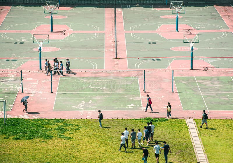 Group of Students Walked Past a Basketball Court in a University Stock ...