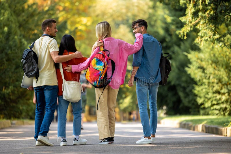 Group of Students Walking in the Park and Looking Excited Stock Photo ...