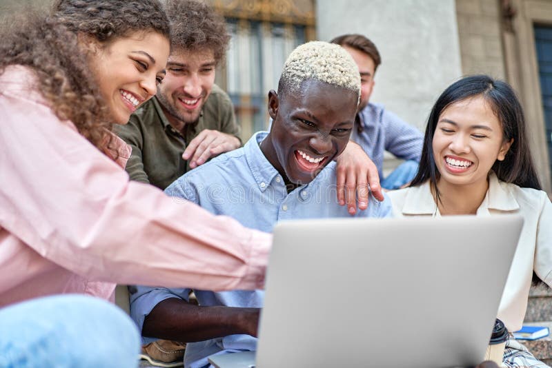 Group of Students Watching a Fun Video on a Laptop. Stock Photo - Image ...