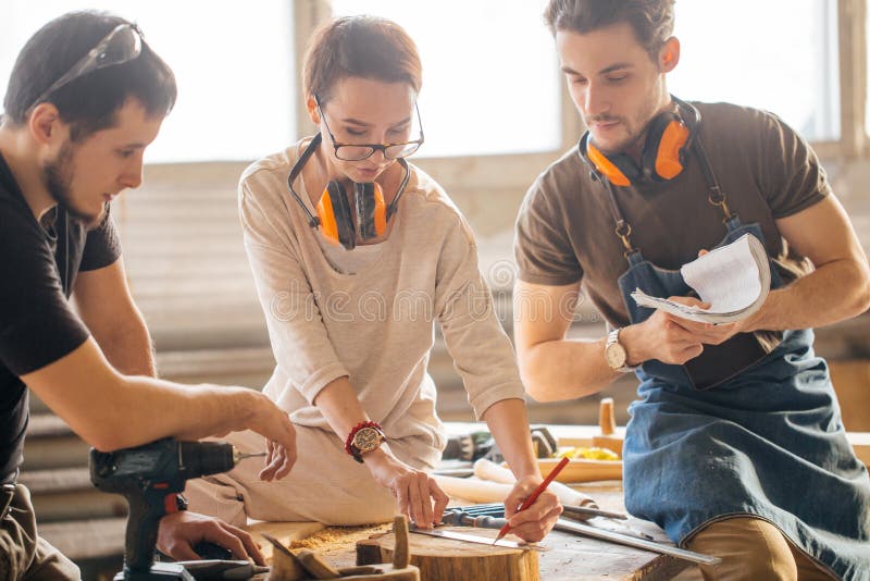 Carpenter Training Female Apprentice To Use Plane Stock Image - Image ...