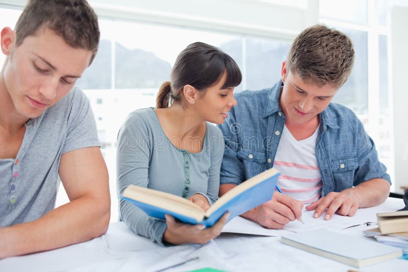 A Group of Students Work Together at Their Homework Stock Image - Image ...