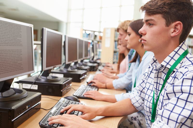 Group of Students Working at Computers in Library Stock Photo - Image ... Group of Students Working at Computers in Library Stock Photo - Image ...