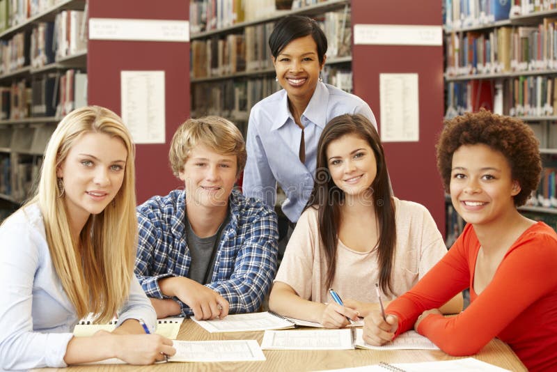 Group of Students Working in Library with Teacher Stock Photo - Image ...