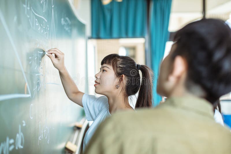 Group of Students Working on the Mathematical Problem Stock Photo ...