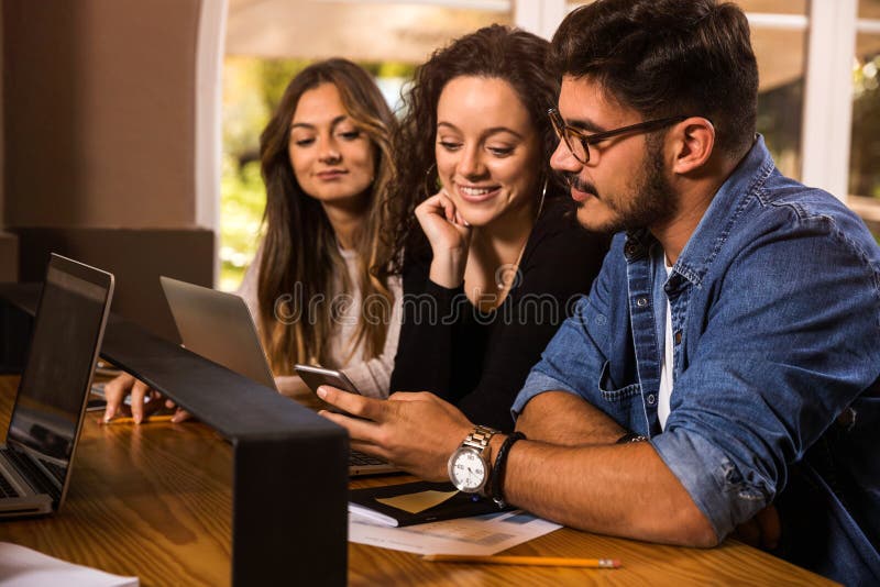 Group of Students Working Together Stock Photo - Image of sitting ...