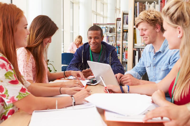 Group of Students Working Together in Library Stock Photo - Image of ...