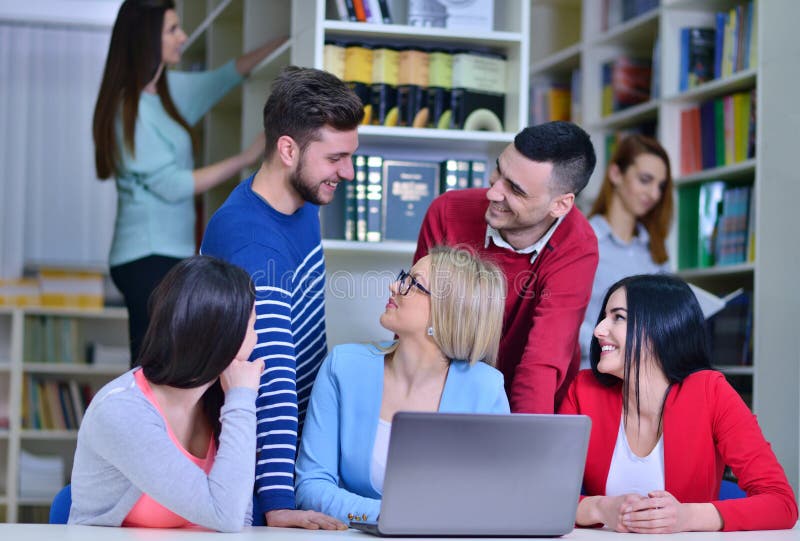 Group of Students Working Together in Library with Teacher Stock Photo ...