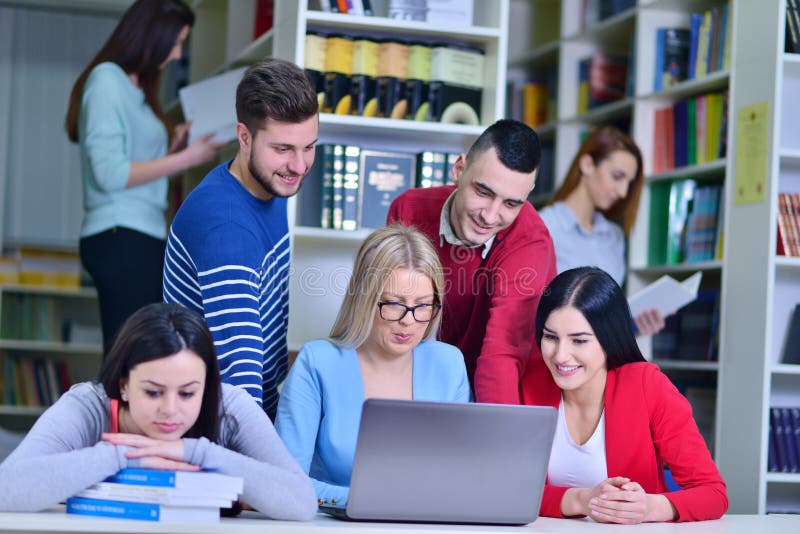 Group of Students Working Together in Library with Teacher Stock Photo ...