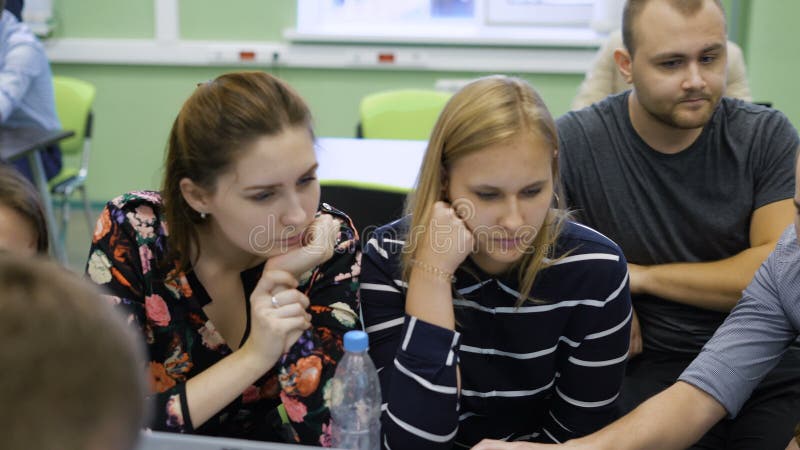 Four Students Working Together on a Project in a Classroom Setting ...