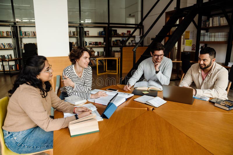 Group of Students Working on University Project in College Library ...