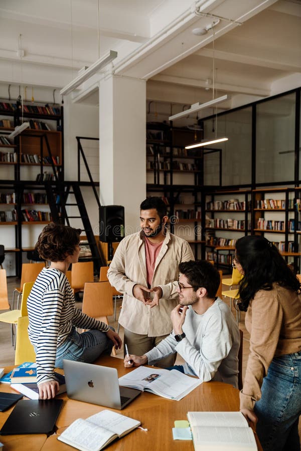 Group of Students Working on University Project in Library Stock Photo ...