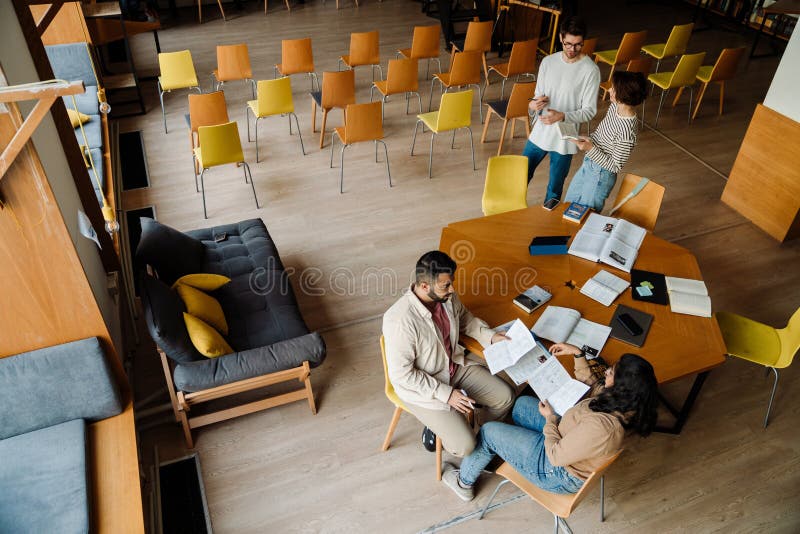 Group of Students Working on University Project in Library Stock Photo ...